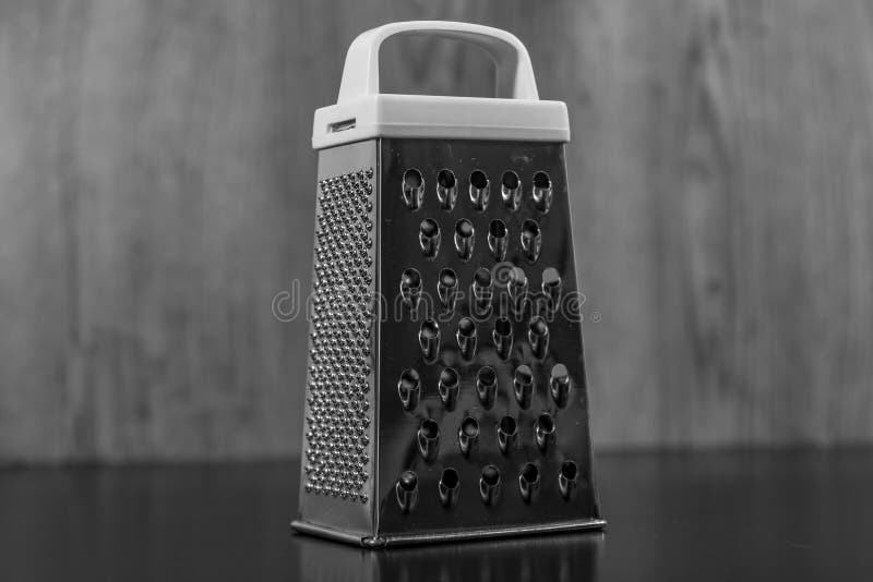 A Black and White Cheese Grater Stock Image - Image of white, black ...
