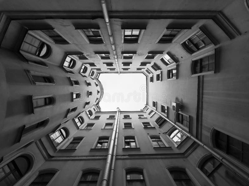 Black and White Courtyard View Looking Up at Building Windows Stock ...