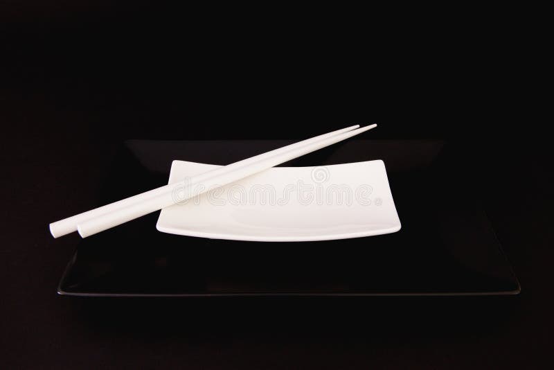 White Empty Sushi Plates with Black and White Bamboo Chopsticks Stock ...