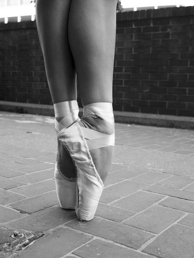 Black and White Version of Athlete Standing with an Ankle Tape Job on ...