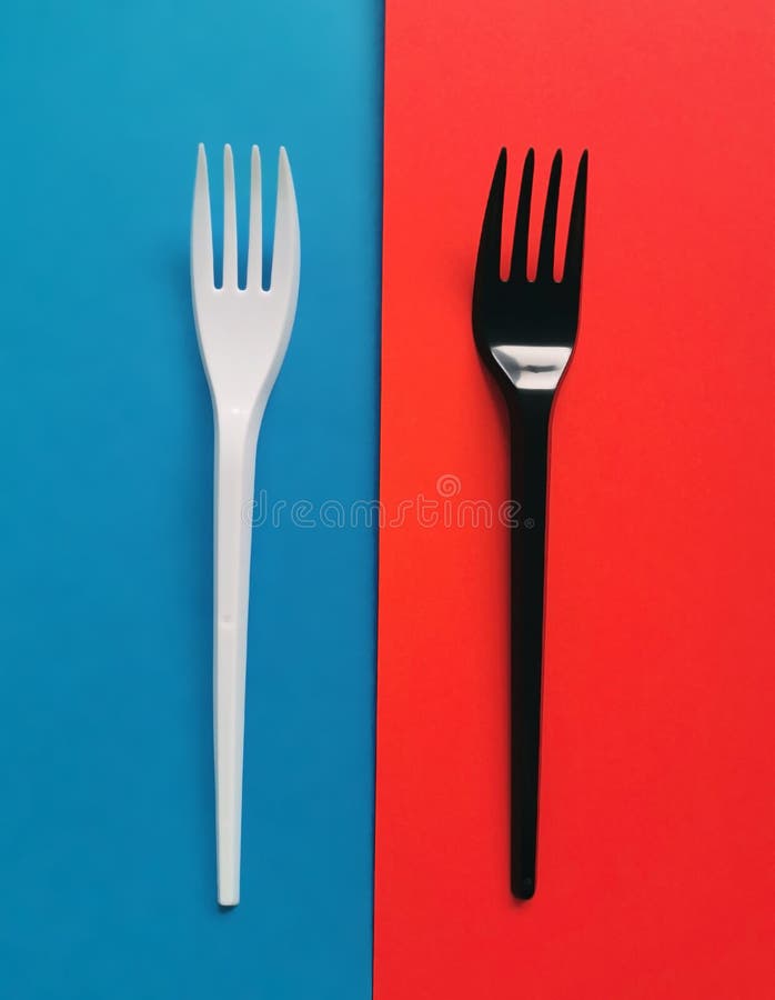 Black and White Forks on Red and Blue Background Stock Photo - Image of ...