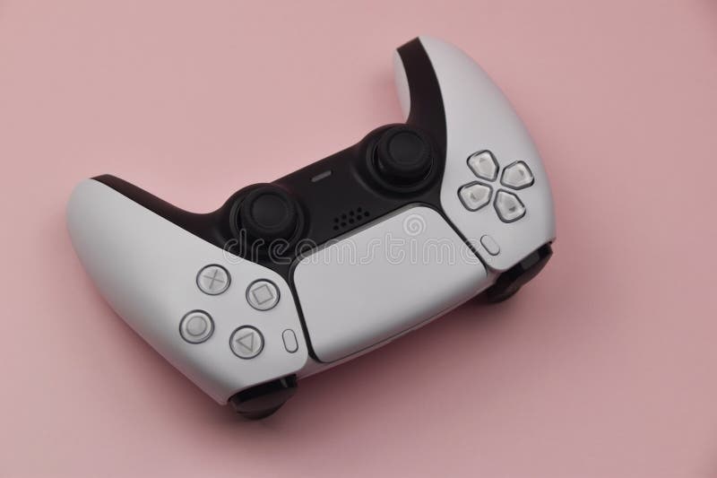 Black and White Game Controllers on Pink Background Editorial ...