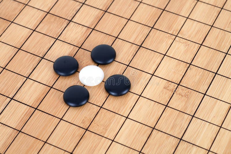 Black and White Go Pieces on the Chessboard Stock Photo - Image of ...