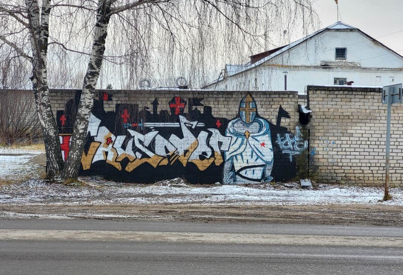 Black and White Graffiti of a Knight on a White Brick Wall. Editorial ...