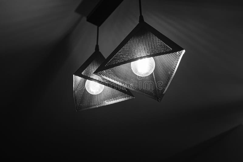 Black and White Hanging Dangling Triangle Ceiling Lamp Stock Photo ...