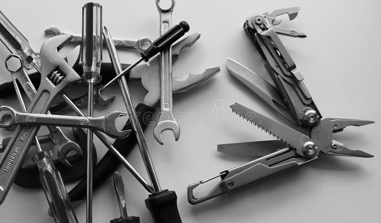 Black and White Image of Blades and Screws of Steel Multi-tool VS Pile ...