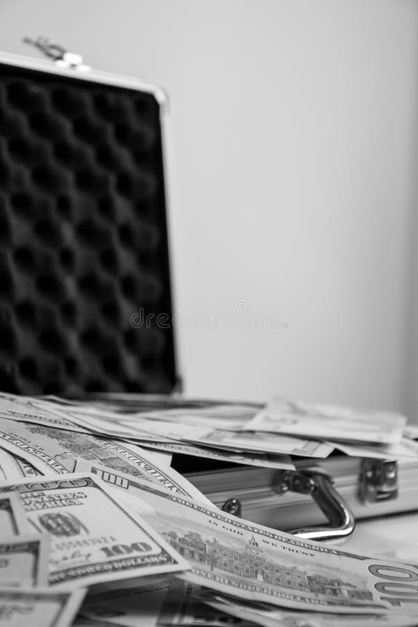 A Black and White Image of an Open Metal Briefcase with Stacks of Cash ...
