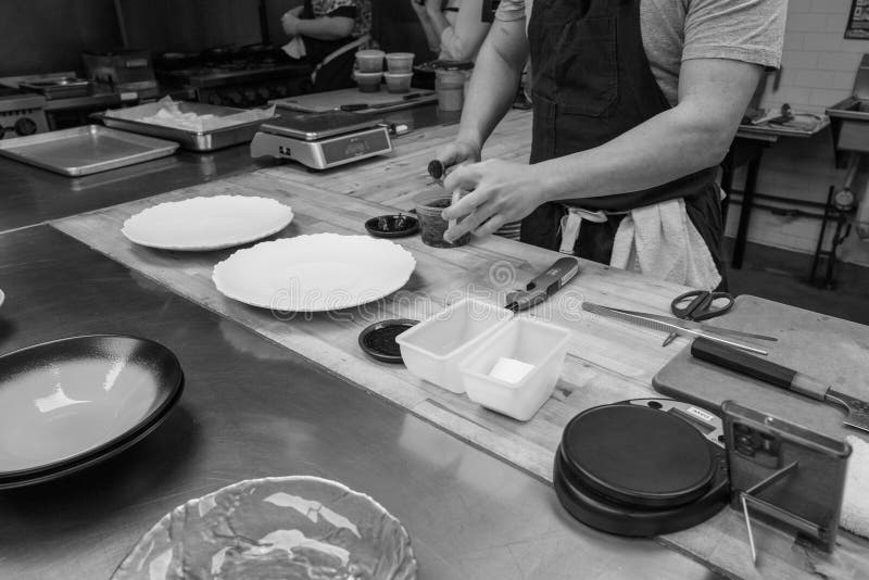 Black and White Image of a Person Cooking in the Kitchen Stock Image ...