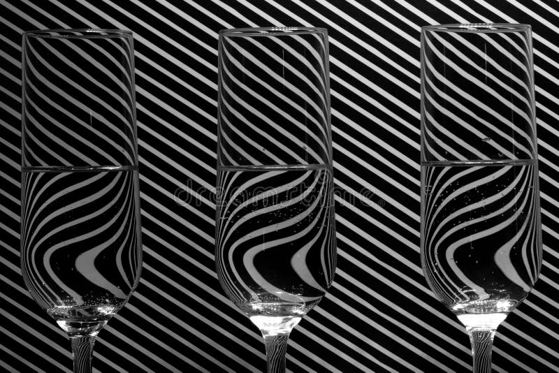 Black and White Image of Three Filled Champagne Glass with Water in ...