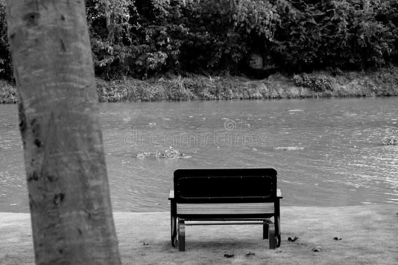 Black and White Landscape Scene with an Empty Park Bench Overlooking ...