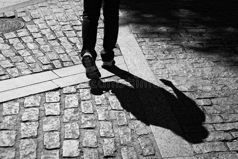 Black and White Legs Casting Shadow Stock Photo - Image of walking ...