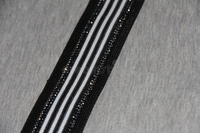 Black and White Line with Rhinestones on Grey Fabric Stock Photo ...