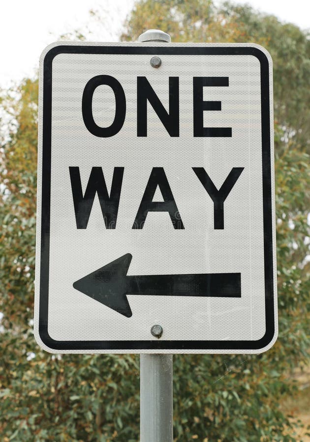 Black and White One Way Sign Against a Tree Background Stock Image ...