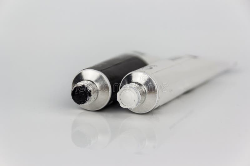 Black and White Paint Tubes on White Background Stock Photo - Image of ...