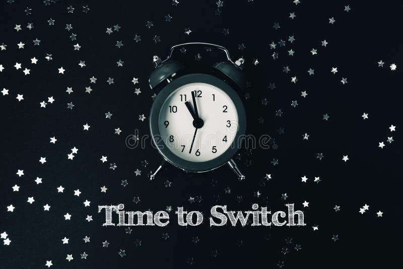 Black and White Photo of a Clock with the Words Time To Switch Stock ...