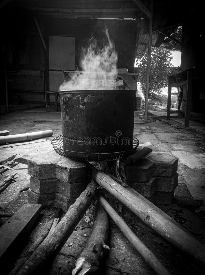 Black and White Photo of Traditional Cooking Using Firewood Over a ...