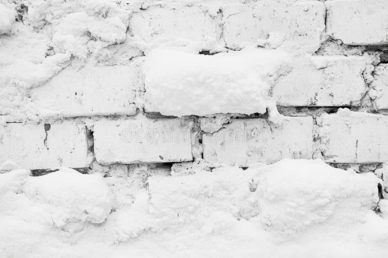 A Black and White Photograph of a Snow-covered Brick Wall Stock Image ...