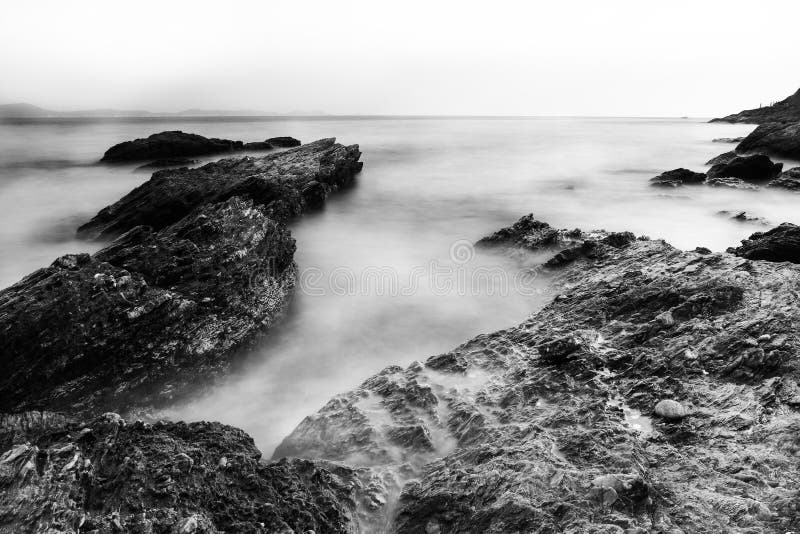 Black and White Photographs of Rocks with a Movement Wave Like Mist ...