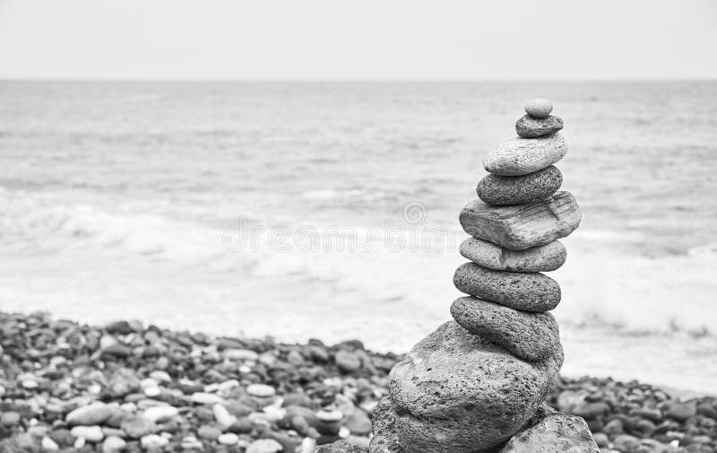 Stack of Beach Stones on Sand Stock Photo - Image of outdoors ...