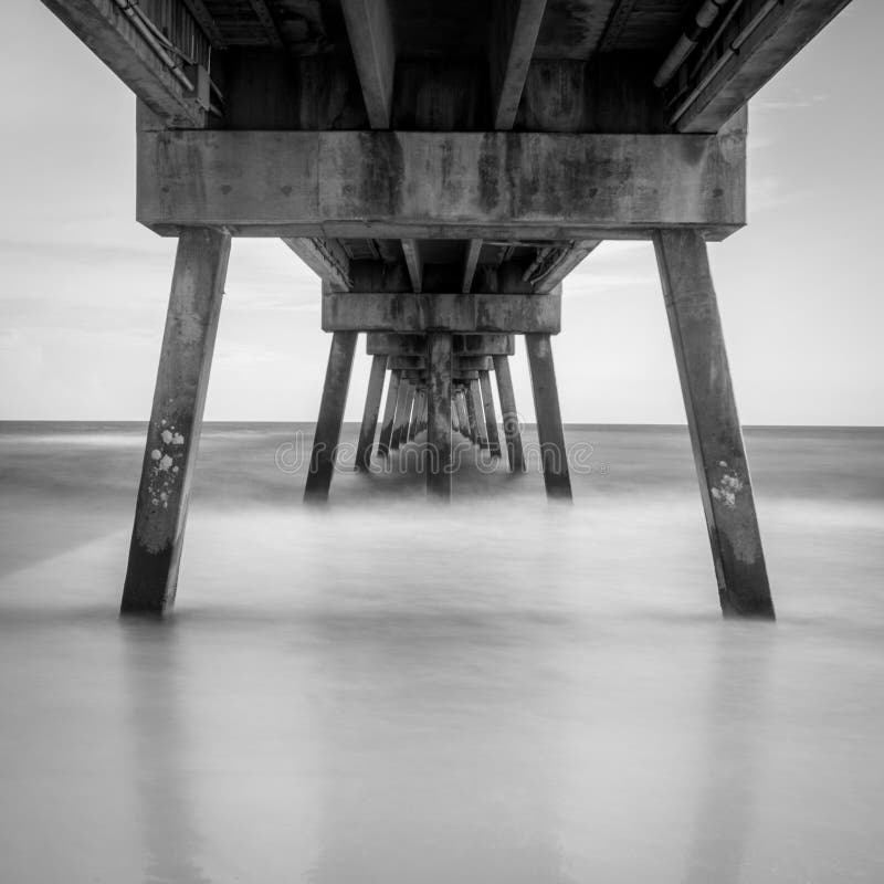 Black and White Pier on the Beach Stock Photo - Image of coast, shore ...