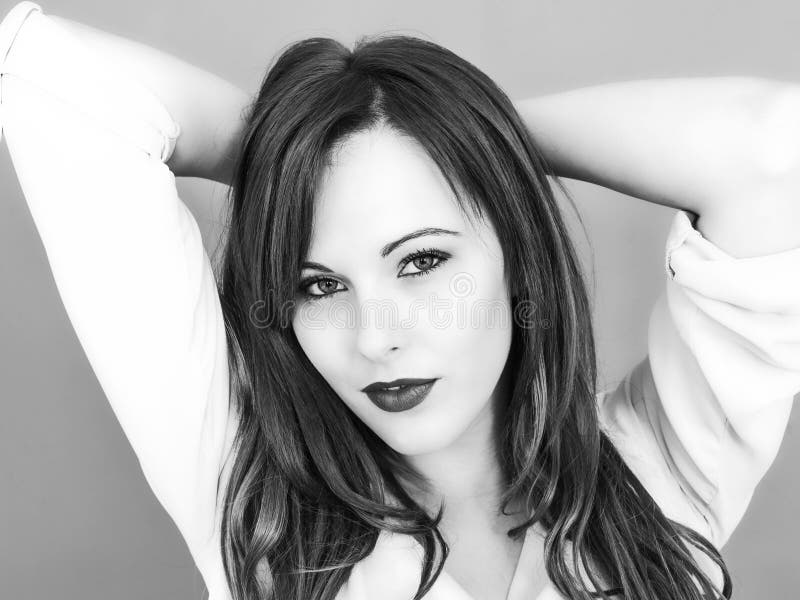 Black And White Portrait Of A Beautiful Young Woman Looking Thou Stock