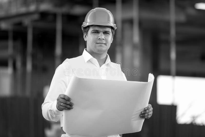 Black and White Portrait of Foreman Posing with Documents and Bl Stock ...