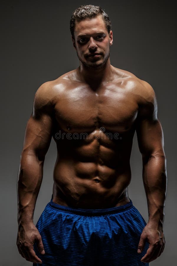 Awesome Muscular Guy Posing in Studio. Stock Image - Image of ...