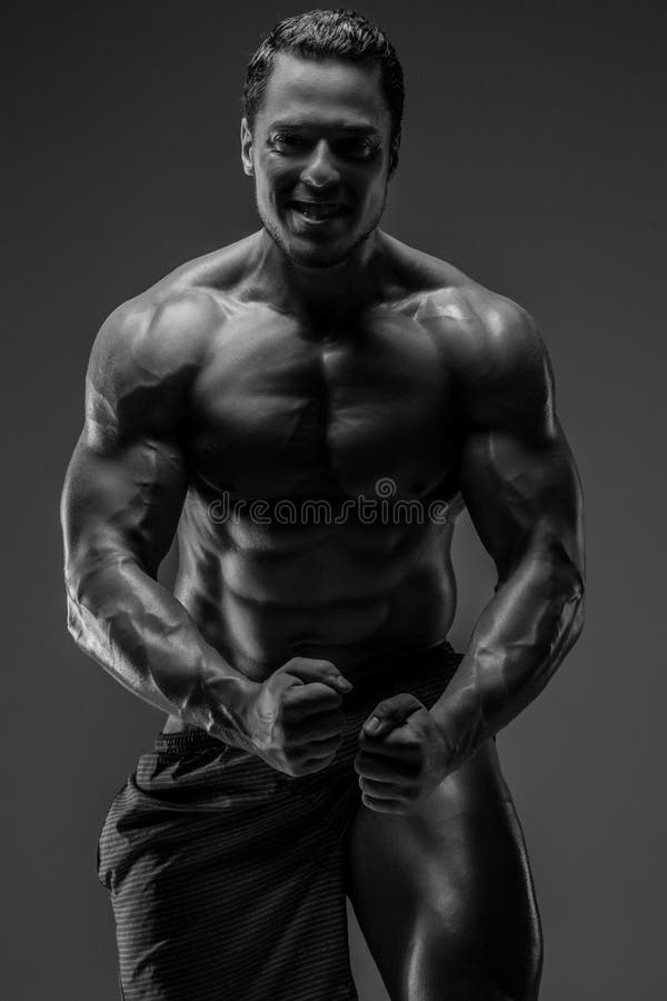 Awesome Muscular Guy Posing in Studio. Stock Image - Image of ...