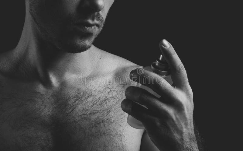 Man with perfume stock image. Image of spray, adult - 161674803