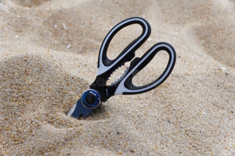 A Black and White Scissors Half-buried in the Sand Stock Image - Image ...