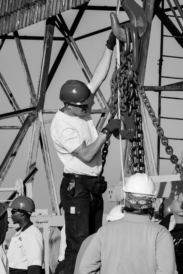 Black and White Shot of Construction Workers with Hard Hats Working ...