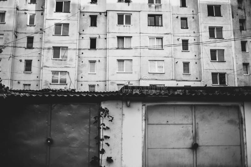 Black and White Shot of a Monotonous Post-soviet Building with Garages ...