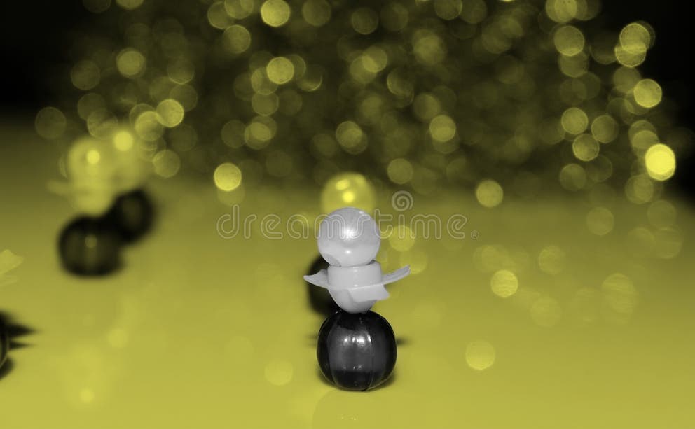 Black and White Small Plastic Objects with Yellowish Background Stock ...