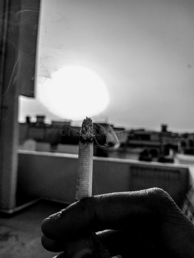 Smoking on the rooftop stock image. Image of white, smoking - 138533975