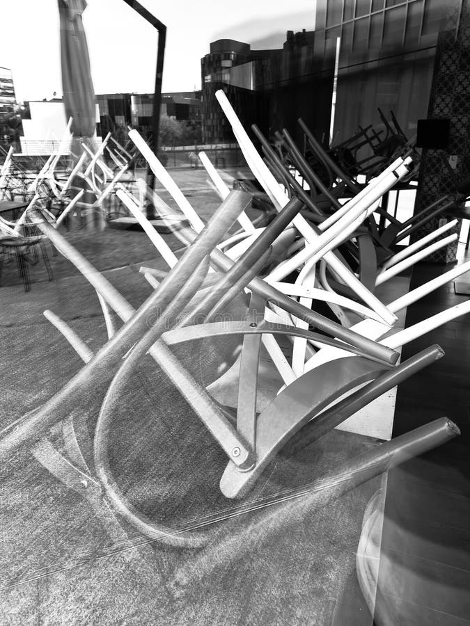 Black and White Texture of Chairs Tipped Over on Tables Stock Image ...