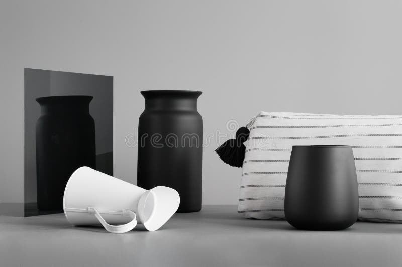 Black and White Vases and a Pouch with Mirror Reflection Stock Image ...