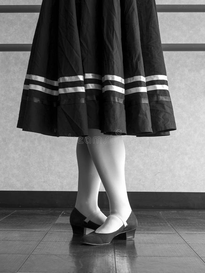 Black and White Dancer Standing in Parallel Position at the Barre, Half ...