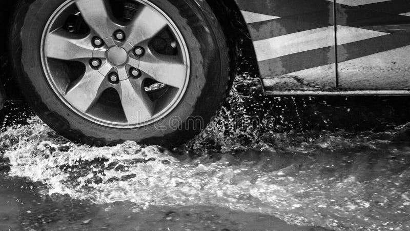 Wheels on the water splash stock photo. Image of spray - 136331274