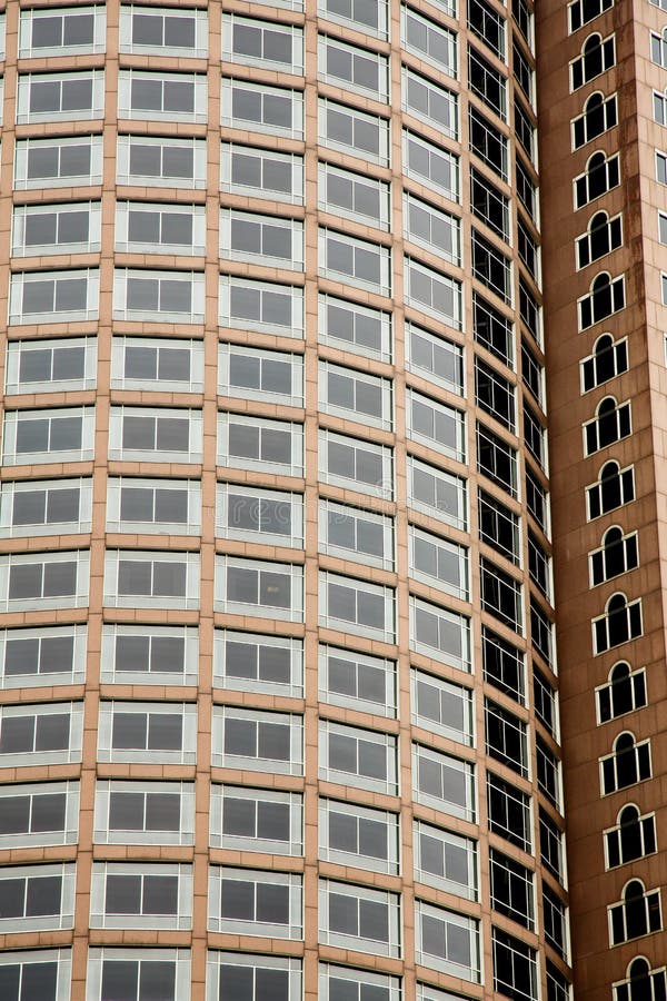 Black Windows on Round Brown Stone Building Stock Photo - Image of ...