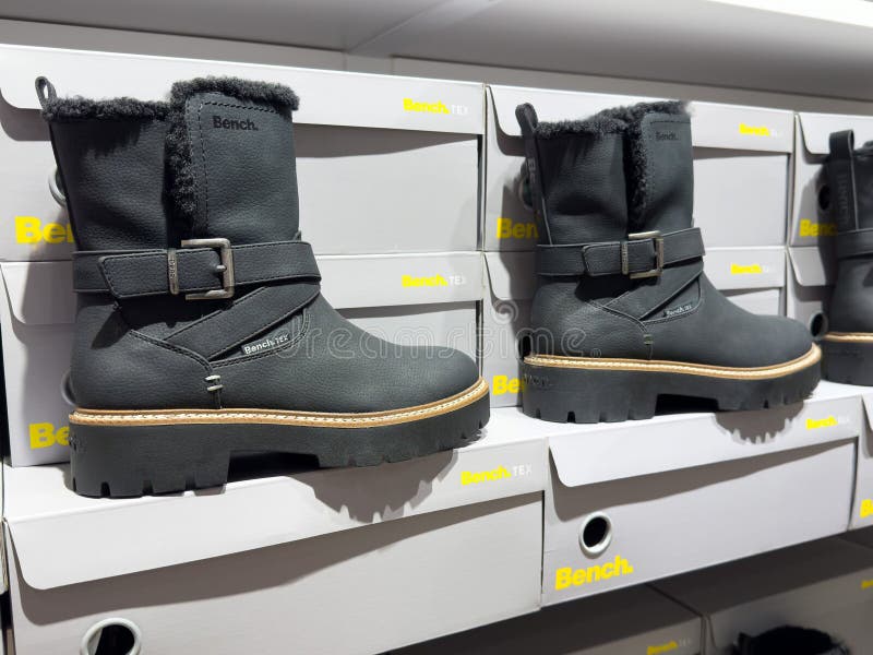 Black Winter Boots on Display Shelf with Box Packaging Editorial Stock ...