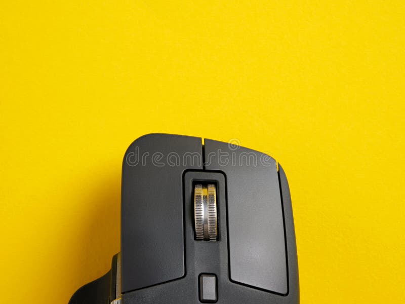 Black Wireless Computer Mouse Scroll Wheel on Yellow Background Stock ...