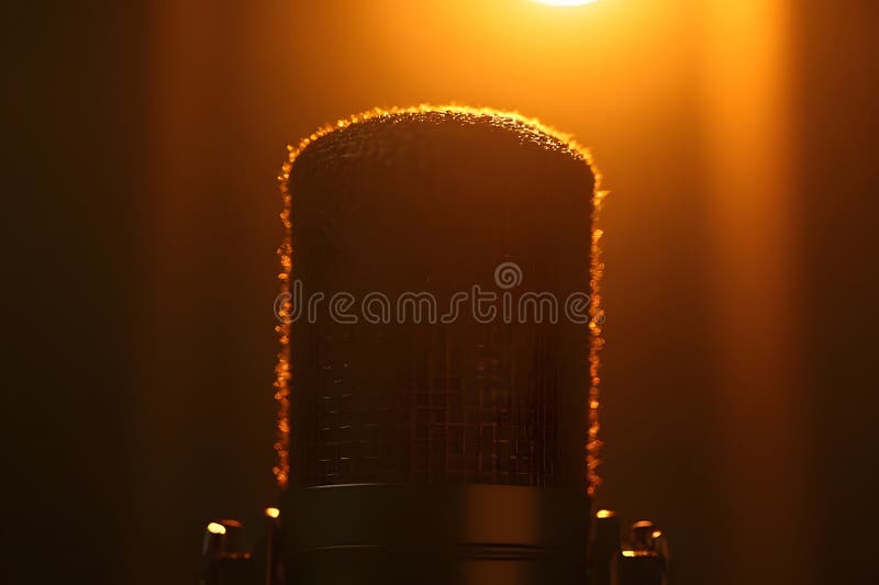 Black Wireless Microphone and Sound Equalizer Placed on a Black Cloth ...