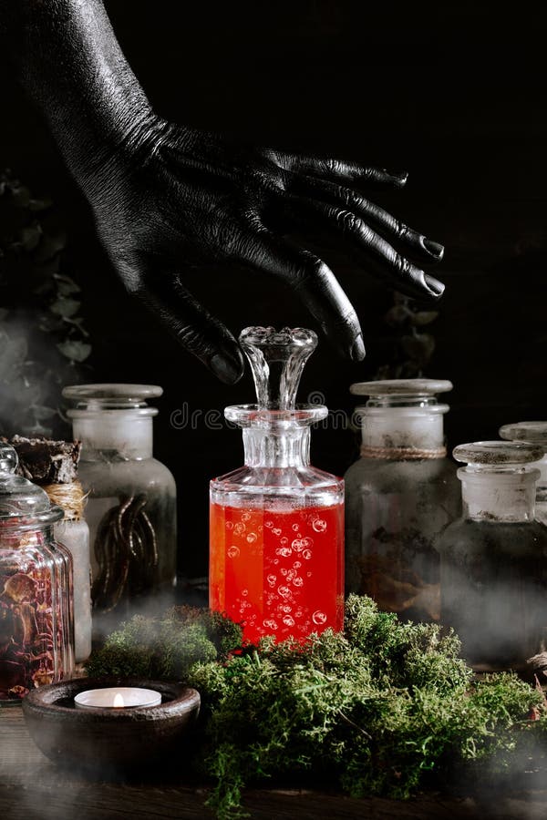 Black Witch Hand Opening Magic Potion, Herbs Ingredients Candles and ...