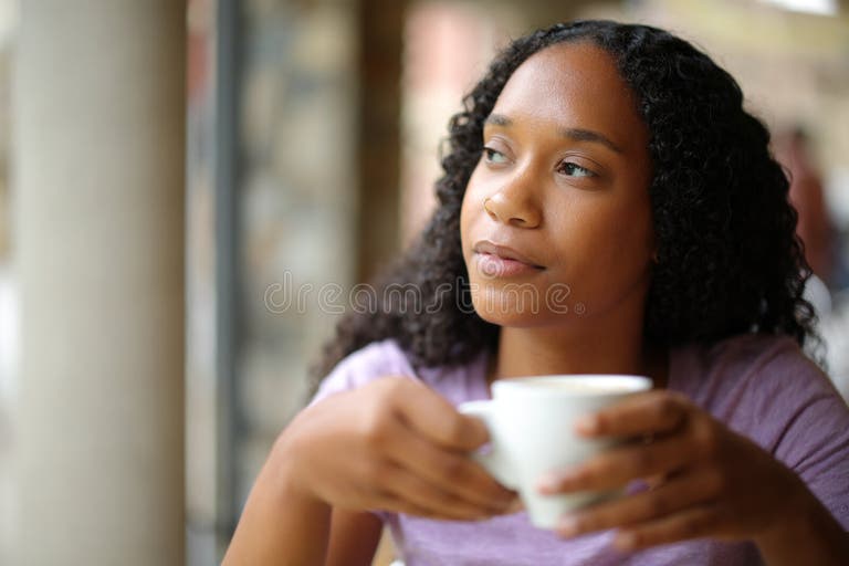 Black Woman Drinking Coffee Thinking Looking at Side Stock Photo ...