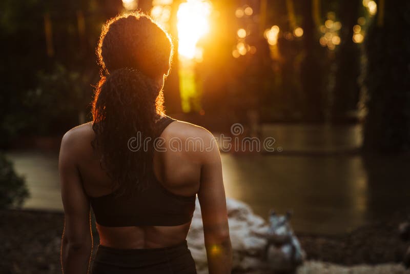 Black Woman Looking Forward while Standing with Her Back with Back ...