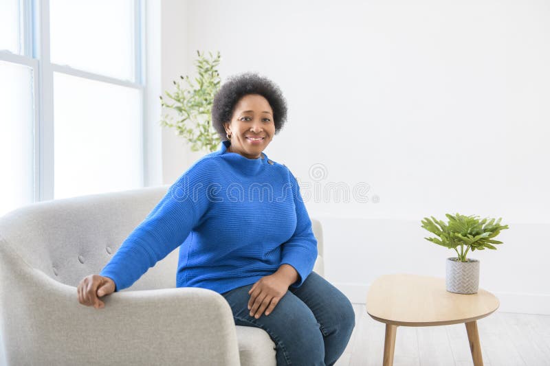 Black Woman Sitting on Sofa at Home Stock Photo - Image of joyful ...