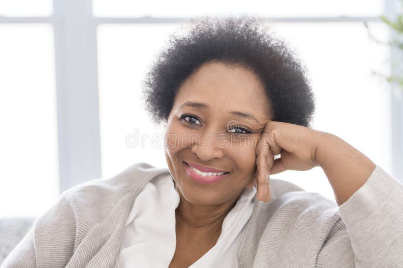 Black Woman Sitting on Sofa at Home Stock Photo - Image of lady, smile ...