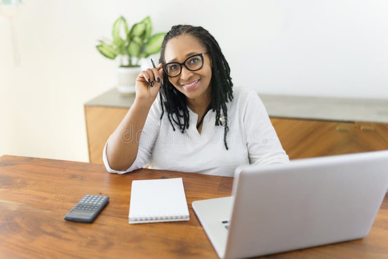 Black Woman Using Computer in Modern Kitchen Interior Stock Photo ...