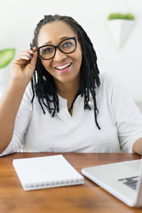 Black Woman Using Computer in Modern Kitchen Interior Stock Image ...