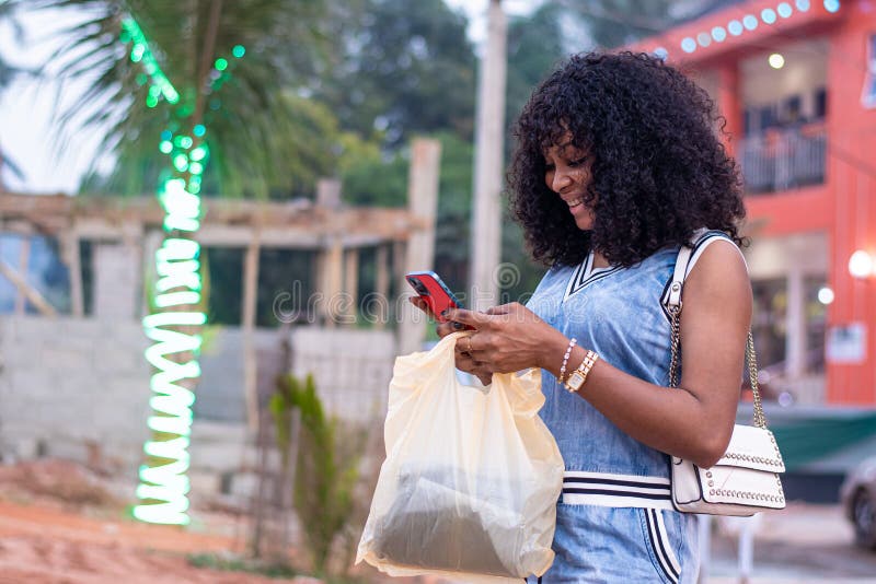 Black Woman Using Her Phone Outdoors Stock Photo - Image of person ...